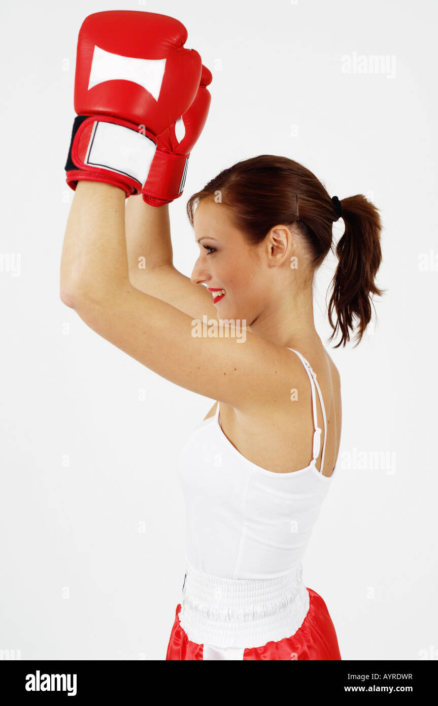 Young female boxer happy over victory Stock Photo - Alamy