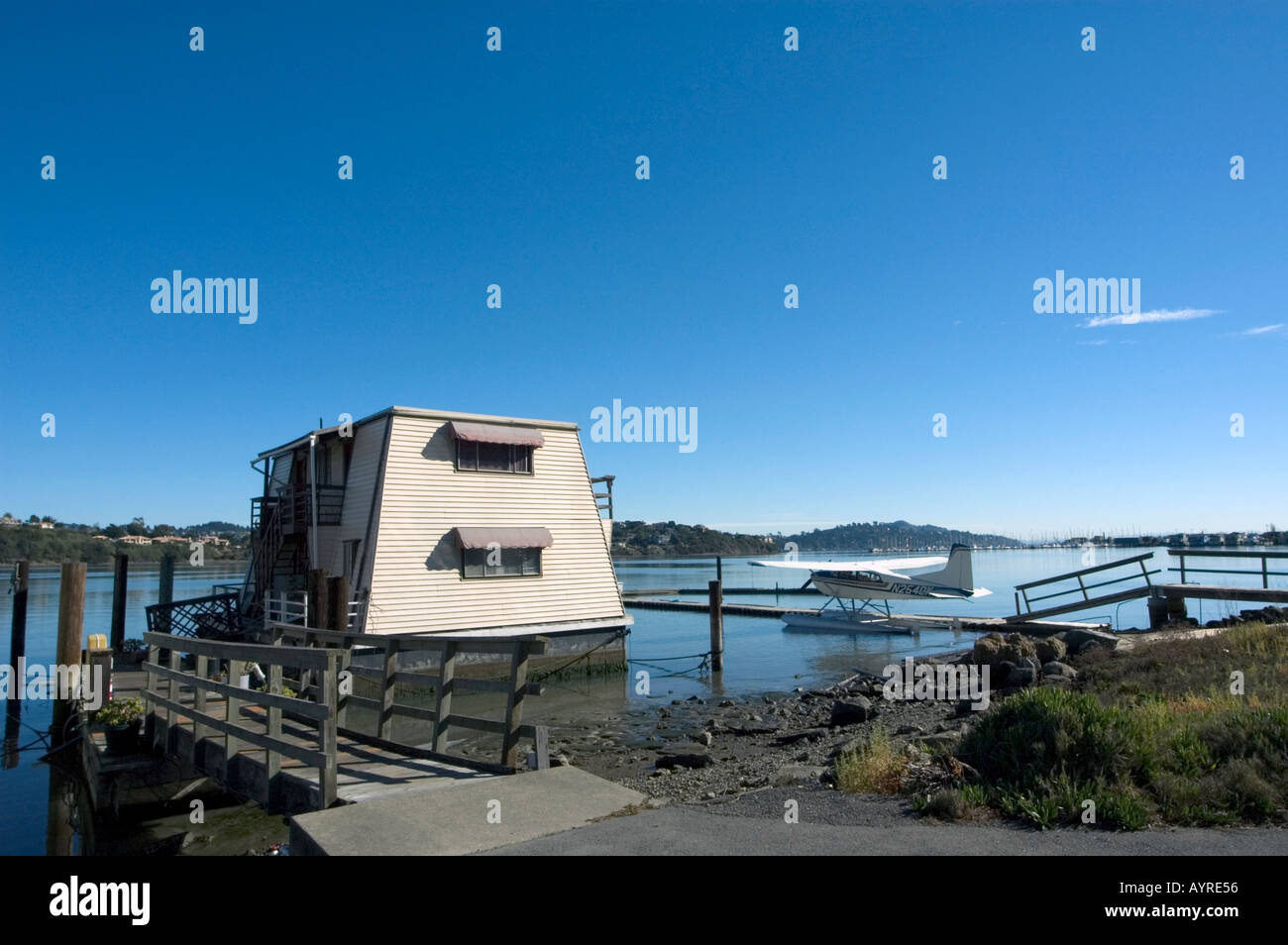 WOODEN HOUSE BOAT WITH HARBORED SEAPLANE IN THE SAUSALITO AREA MARIN ...
