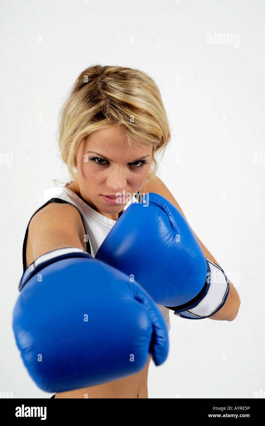 Young female boxer, forward punch Stock Photo - Alamy