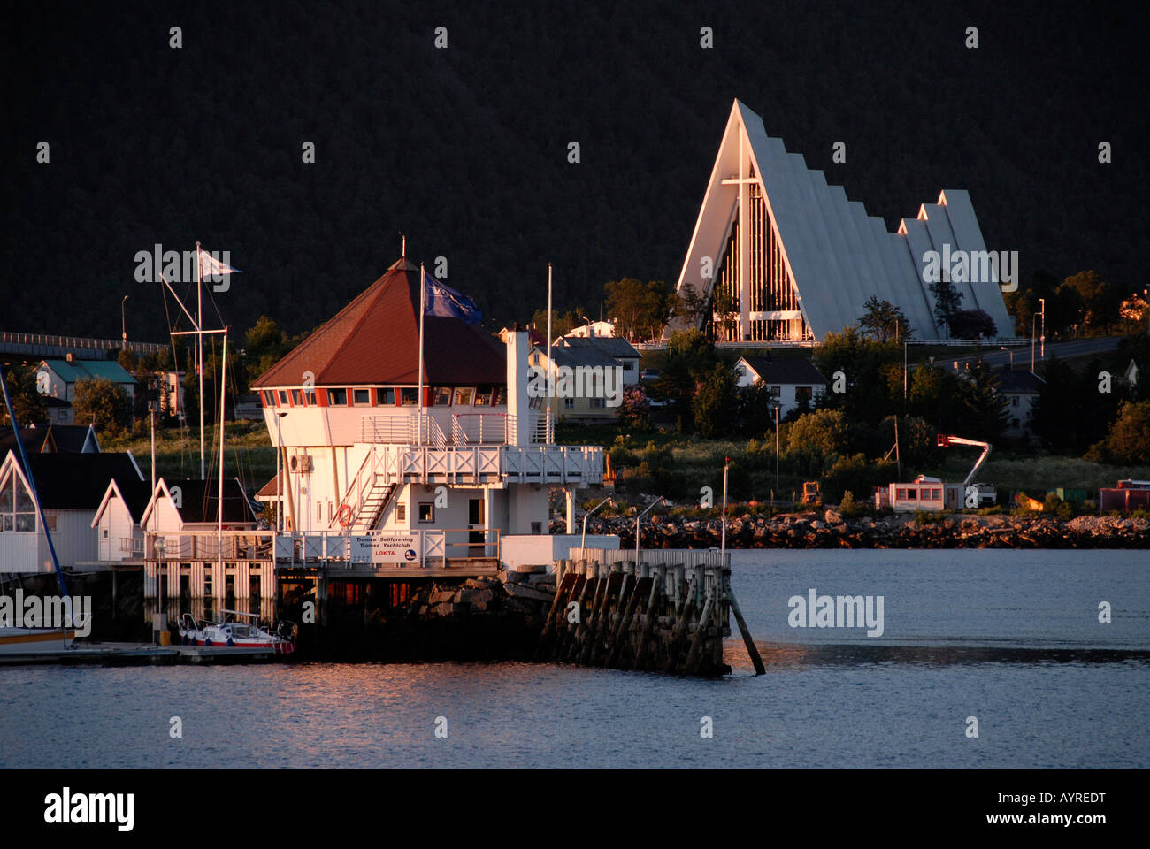 Harbour in front of modern triangular Christian church ...