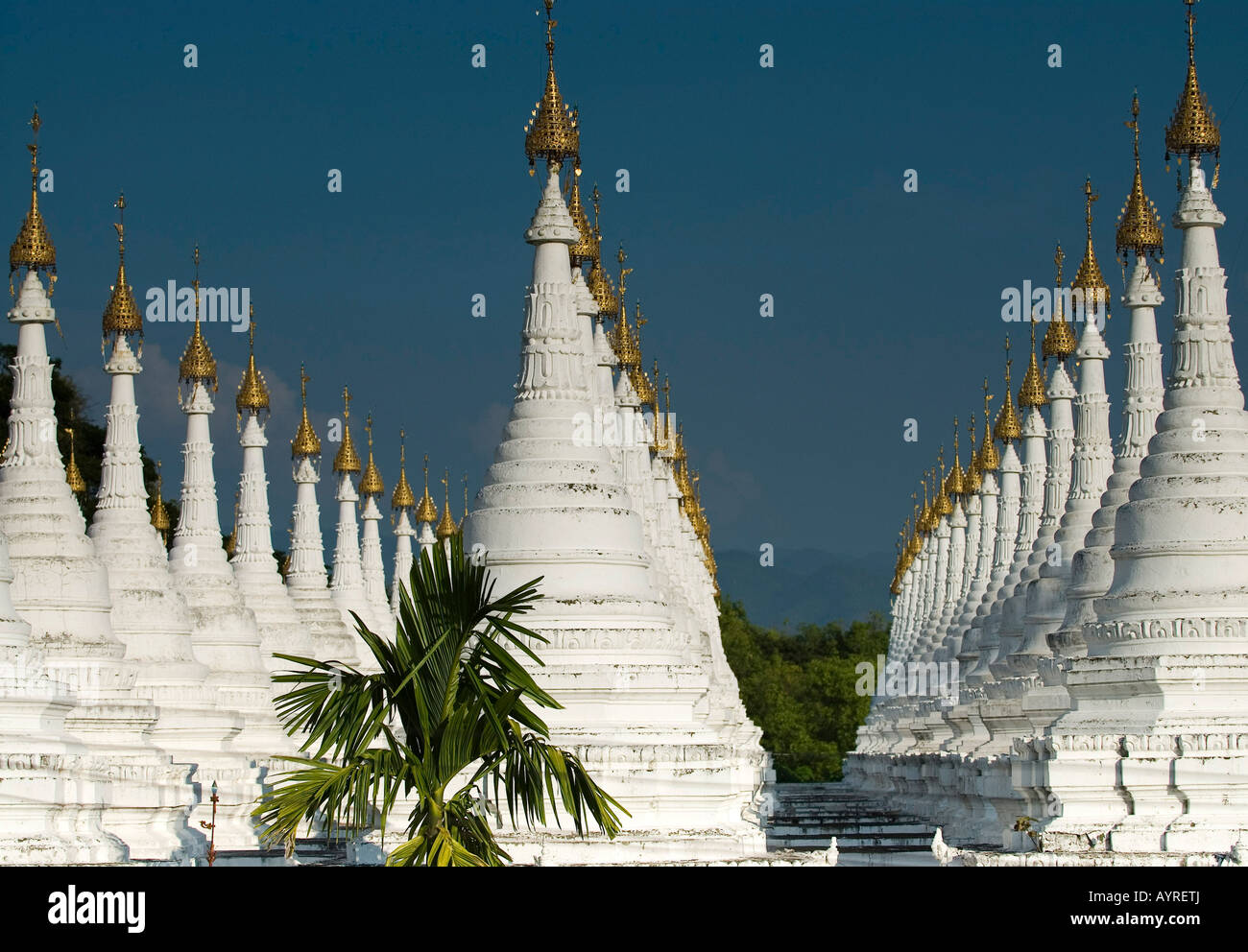 Lots of golden-tipped white stupas in three rows, Mandalay, Myanmar ...