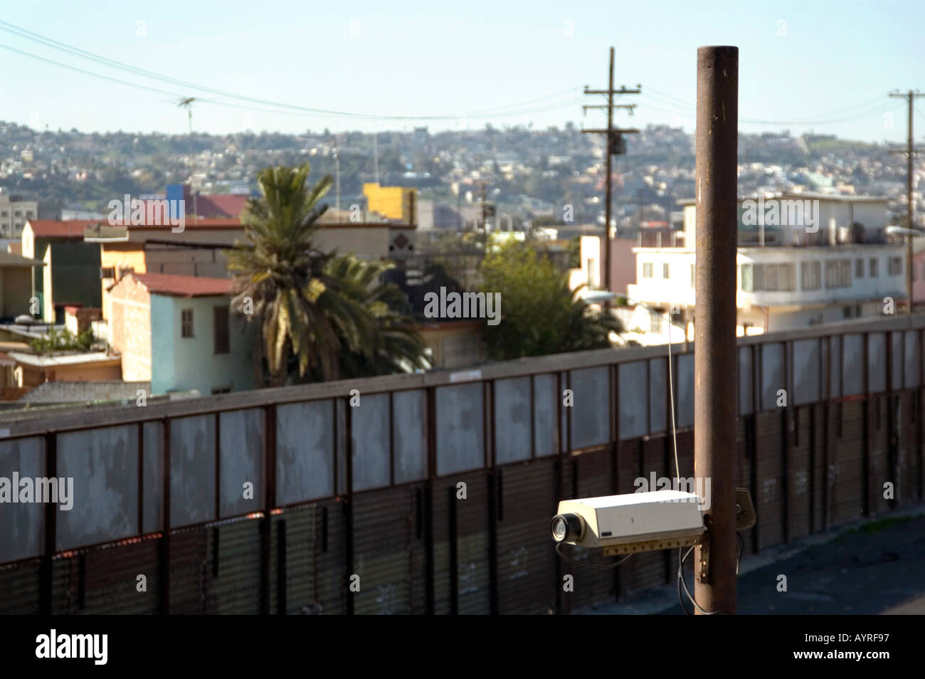 CCTV SECURITY CAMERA ON THE MEXICAN UNITED STATES BORDER WITH BARRIER ...