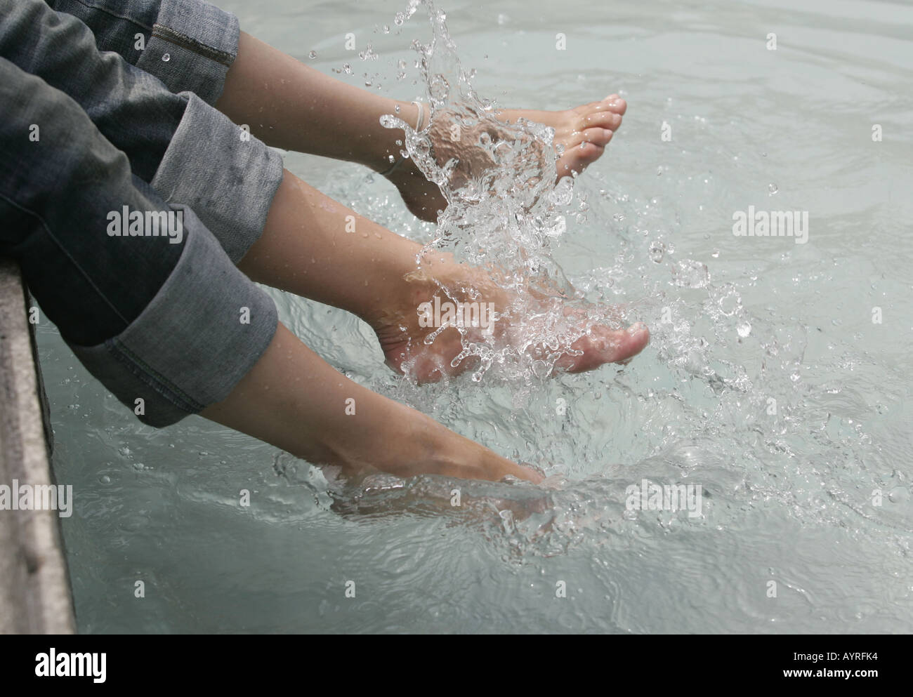 People dipping feet in water hi-res stock photography and images - Alamy