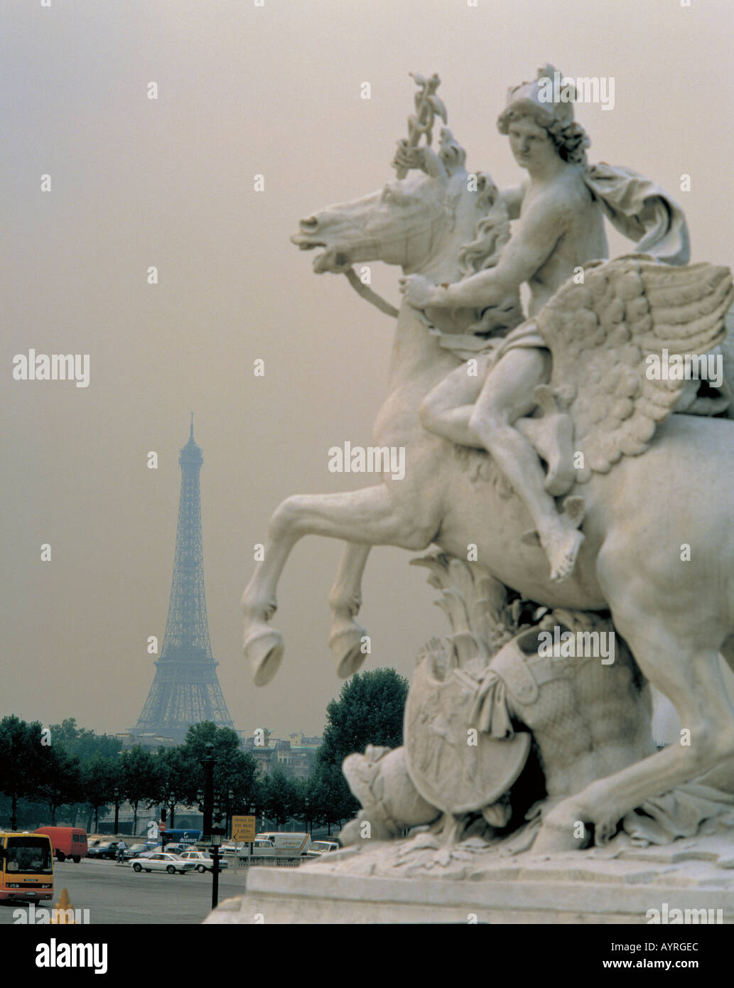 Eiffel Tower with White Statue Stock Photo - Alamy