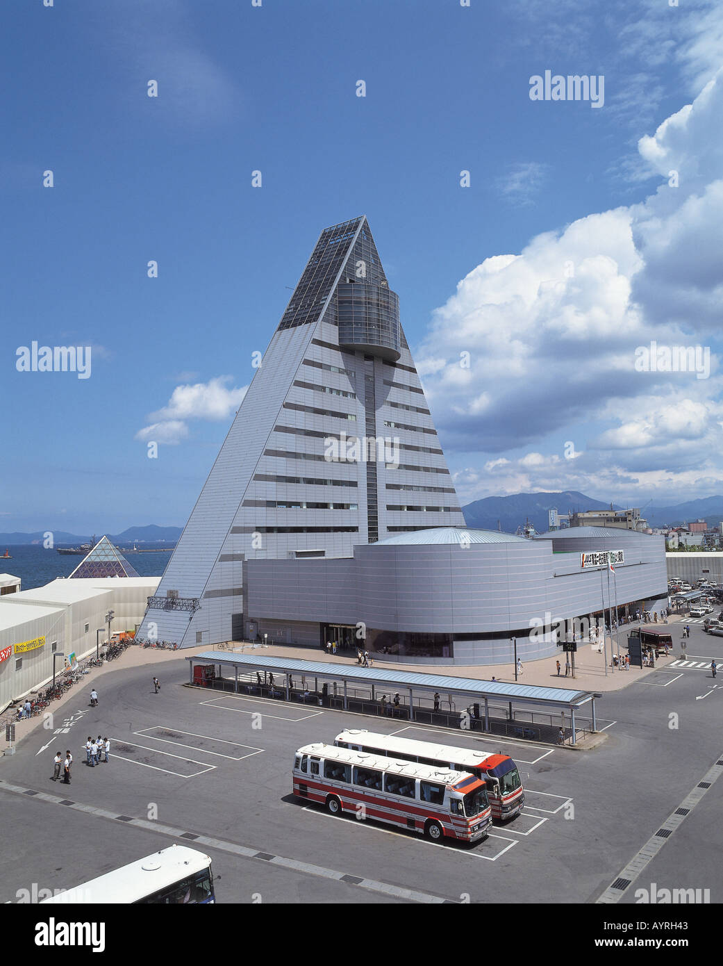 Modern Triangle Building with Buses Stock Photo - Alamy