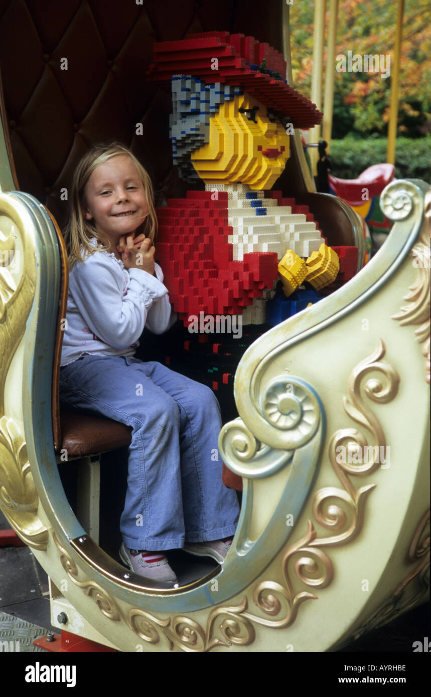 Lucy at legoland on carousel with lego woman, Windsor UK Stock Photo ...