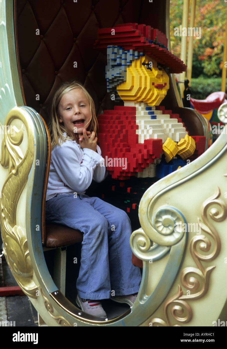 Lucy at legoland on carousel with lego woman, Windsor UK Stock Photo ...