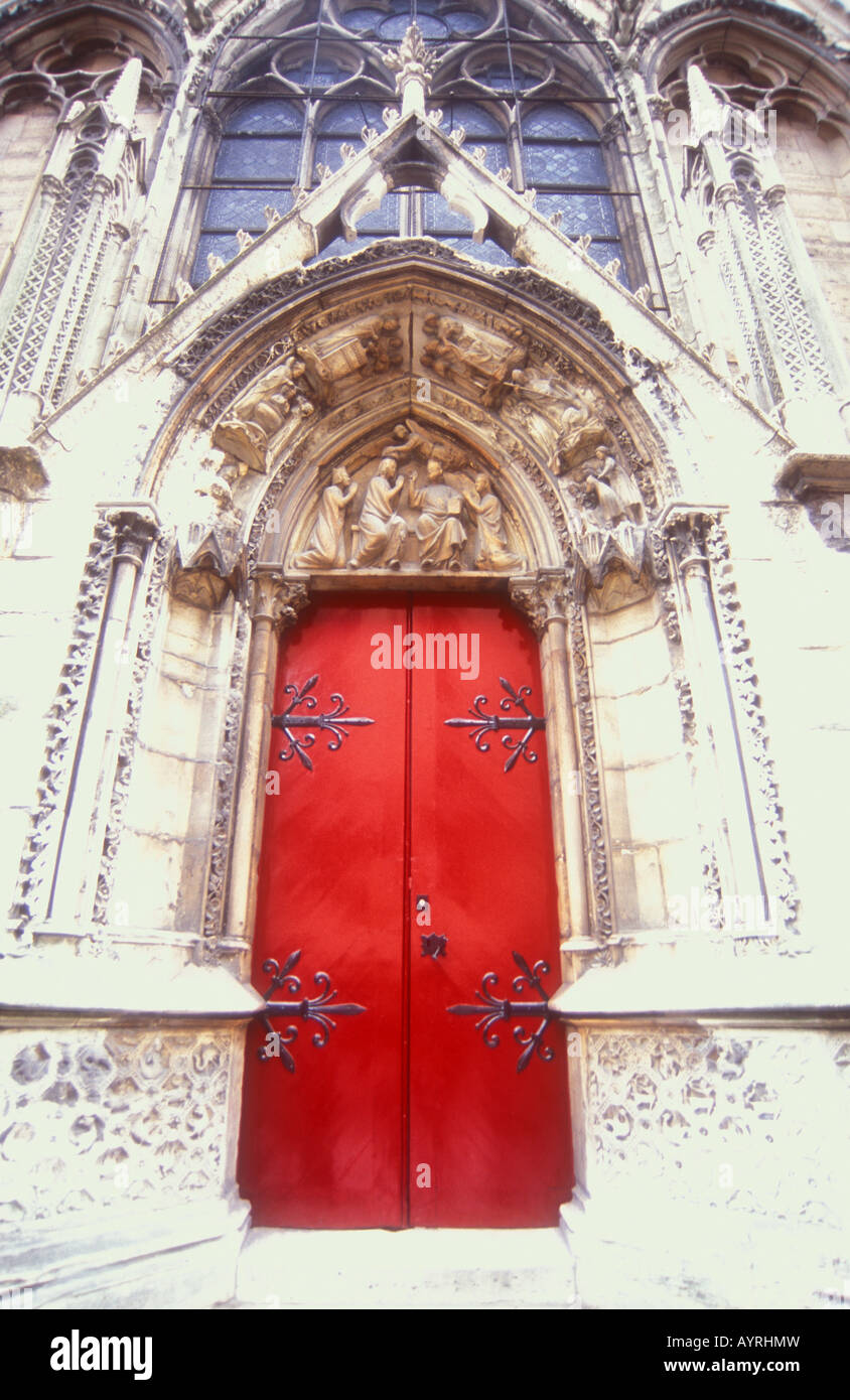 A red door on the side of Notre Dame Cathedral, Paris France Stock ...