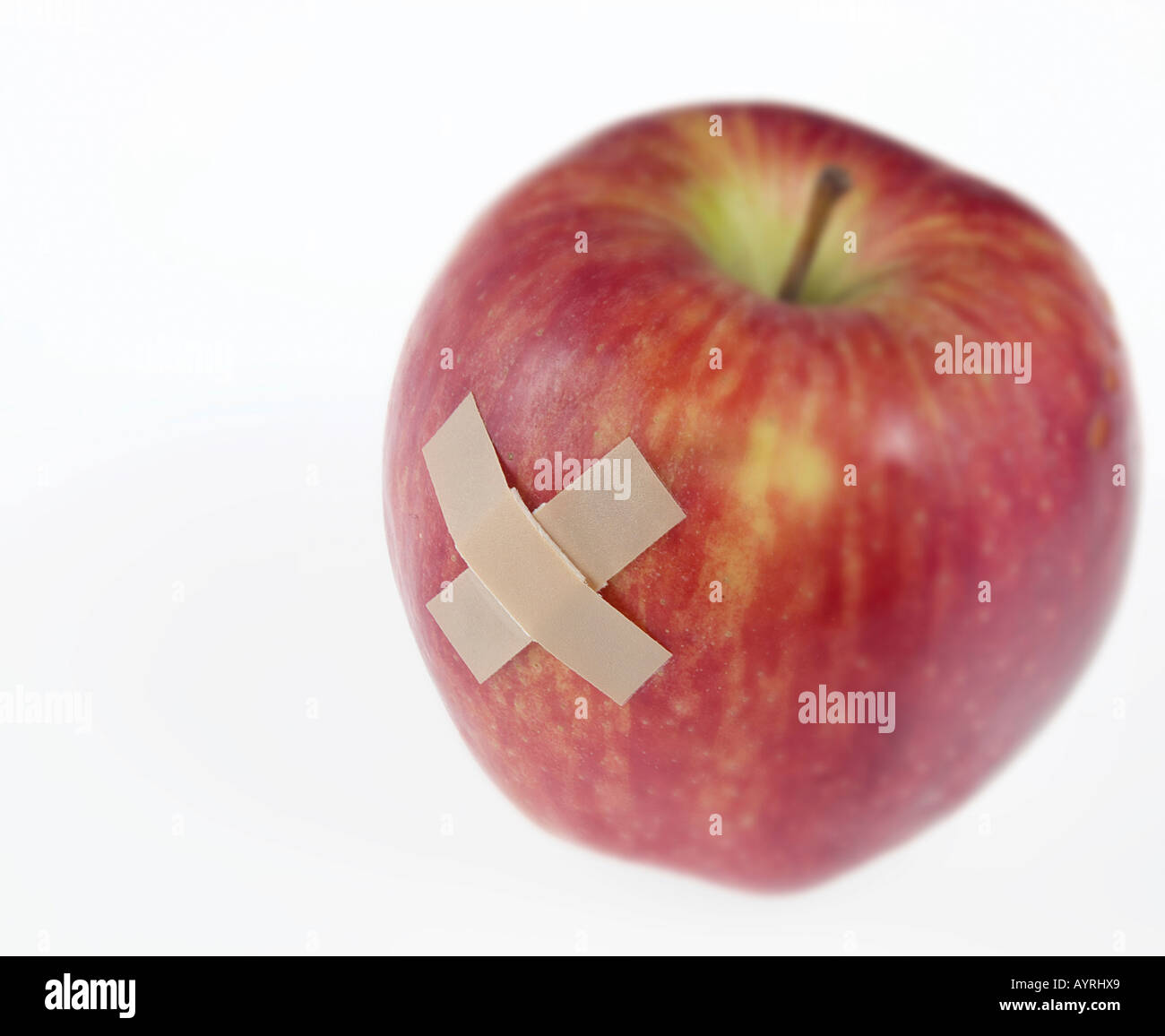 apple with plaster Stock Photo - Alamy