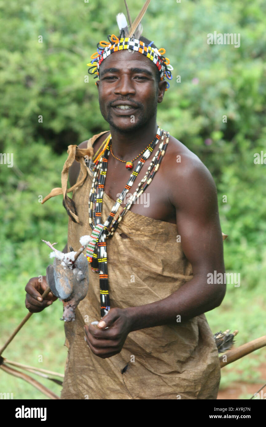 Africa Tanzania Lake Eyasi Hadza male with a bird spiked on an arrow ...