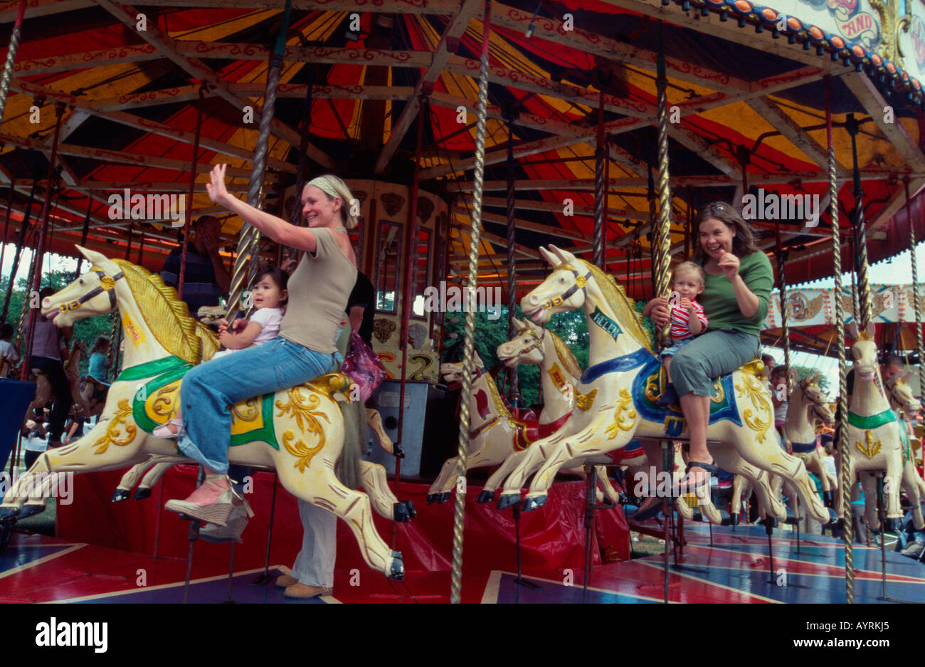 Carousel, the funfair at the Hampton Court Craft Fair, West London, UK ...