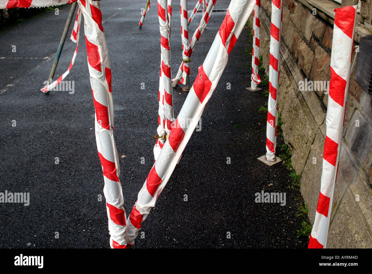 Red and White Tape on Scaffolding Poles Stock Photo - Alamy