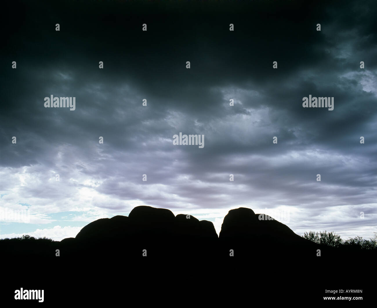 Stormy clouds over Kata Tjuta Mount Olga Uluru National Park Northern ...