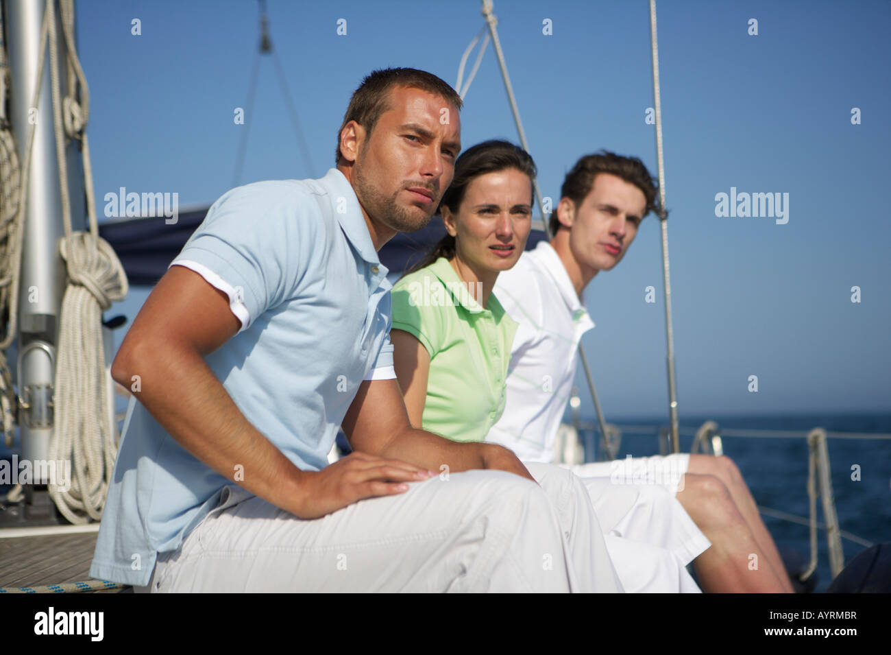 Three people sitting on a boat, looking angry Stock Photo, Royalty Free ...