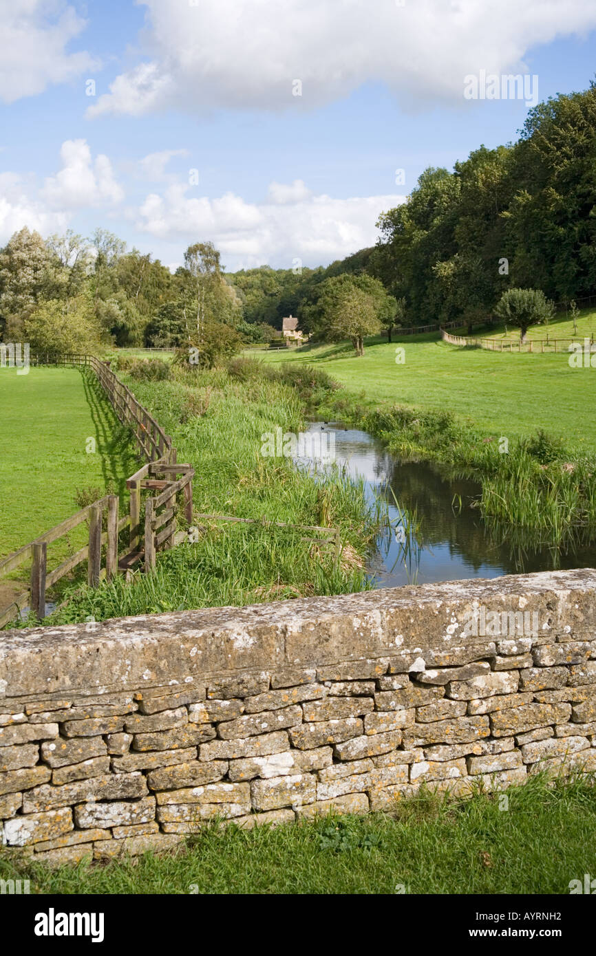 The River Coln at the Cotswold village of Coln Rogers, Gloucestershire ...