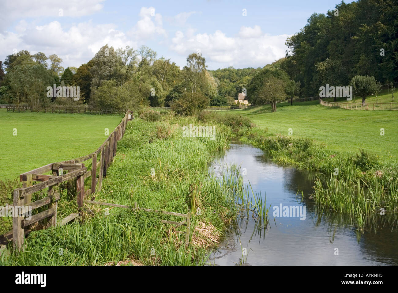 The River Coln at the Cotswold village of Coln Rogers, Gloucestershire ...