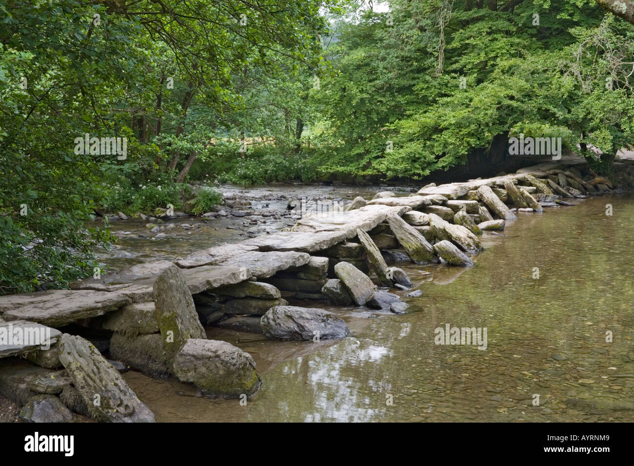 The prehistoric clapper bridge across the River Barle at Tarr Steps ...