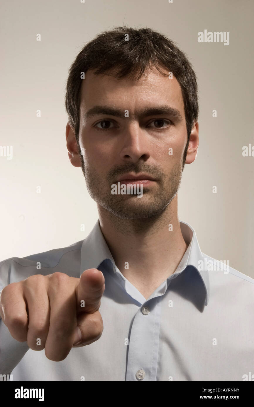 Man pointing his index finger Stock Photo - Alamy