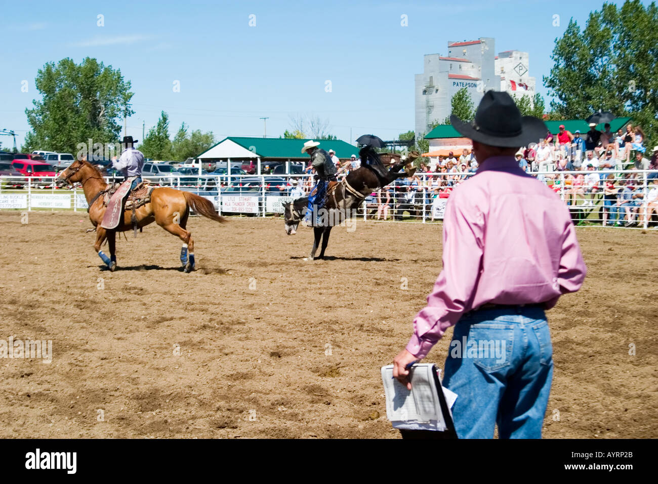 Saddle Bronc riding at the Herbert Rodeo Stock Photo - Alamy
