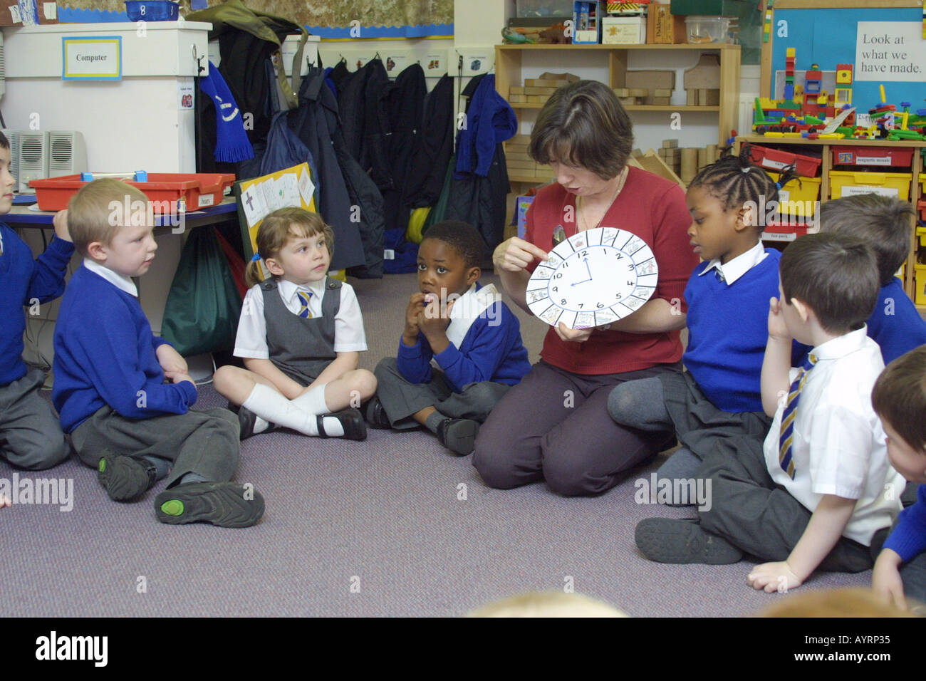 young chidlren in reception class learning to read the time through ...