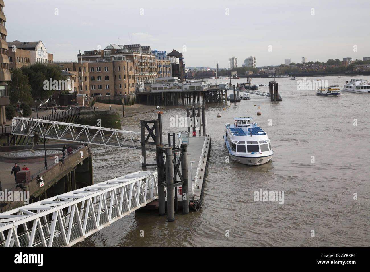 River Thames boats by St Katherine's Dock London England Stock Photo ...
