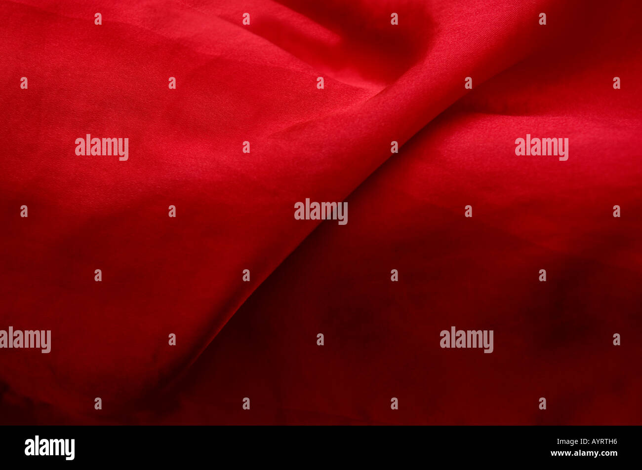 Bright red silk fabric with creases and shadows Stock Photo - Alamy