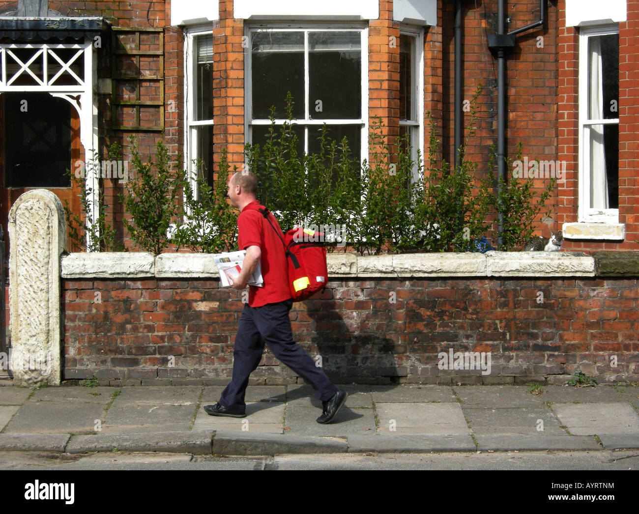 postman delivering mail Stock Photo - Alamy