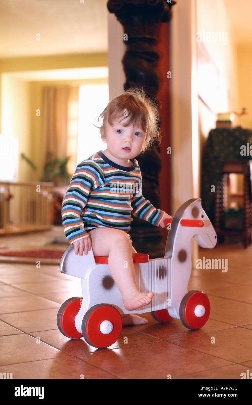 BOY RIDING TOY PONY Stock Photo - Alamy