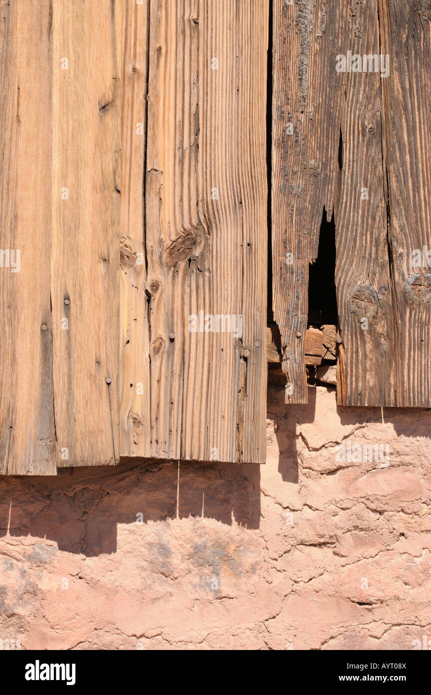 Wooden panels on an old stone building Stock Photo - Alamy
