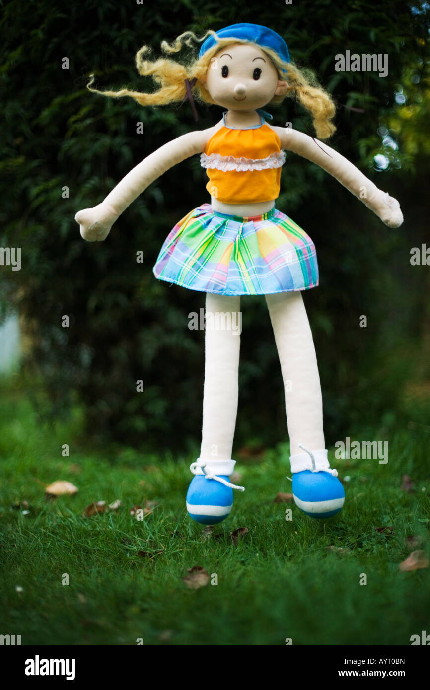 Doll dropped from above appears to be floating on lawn Stock Photo - Alamy