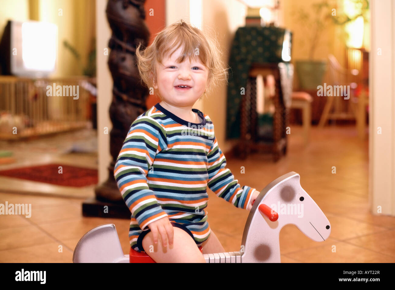 BOY RIDING TOY PONY Stock Photo - Alamy