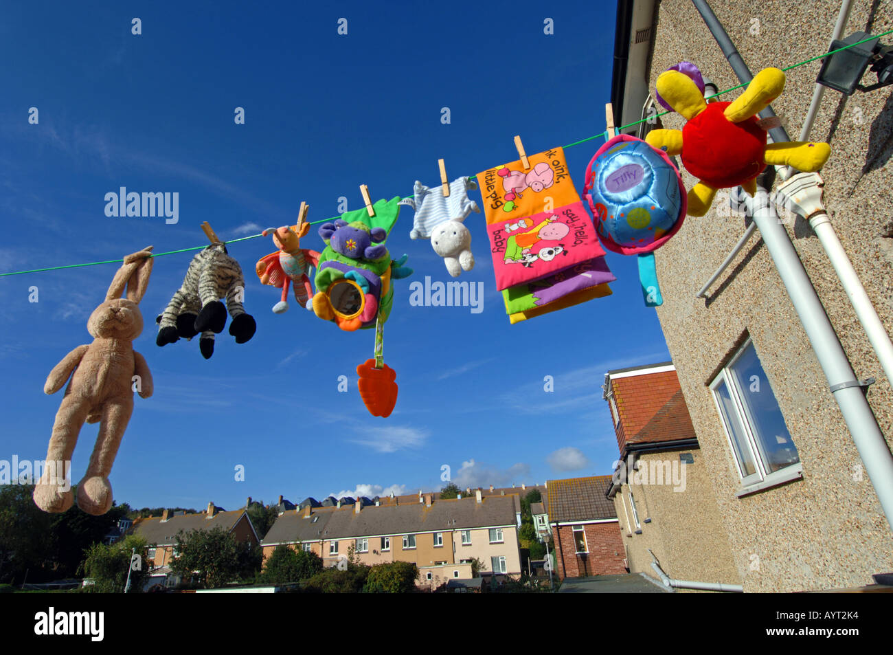 Soft toys drying on a washing line Stock Photo - Alamy