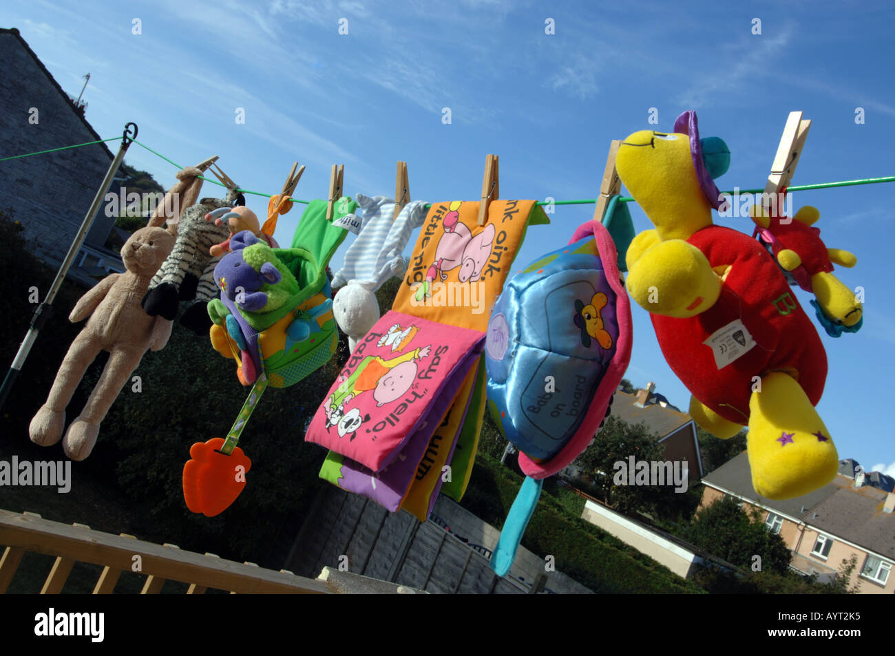 Soft toys drying on a washing line Stock Photo - Alamy