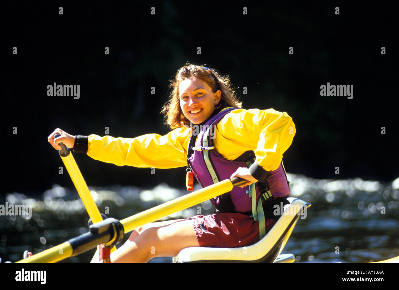 White water rafting Woman guiding a row frame USA Kennebec River Maine ...