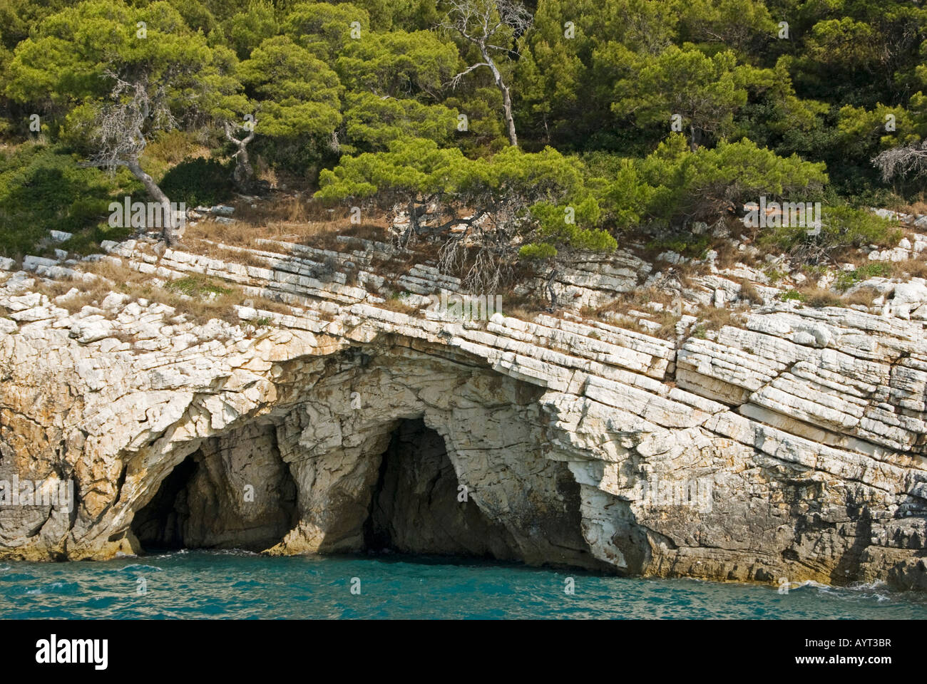 Coastal cliffs at the very tip of the heel of the Italian "boot ...