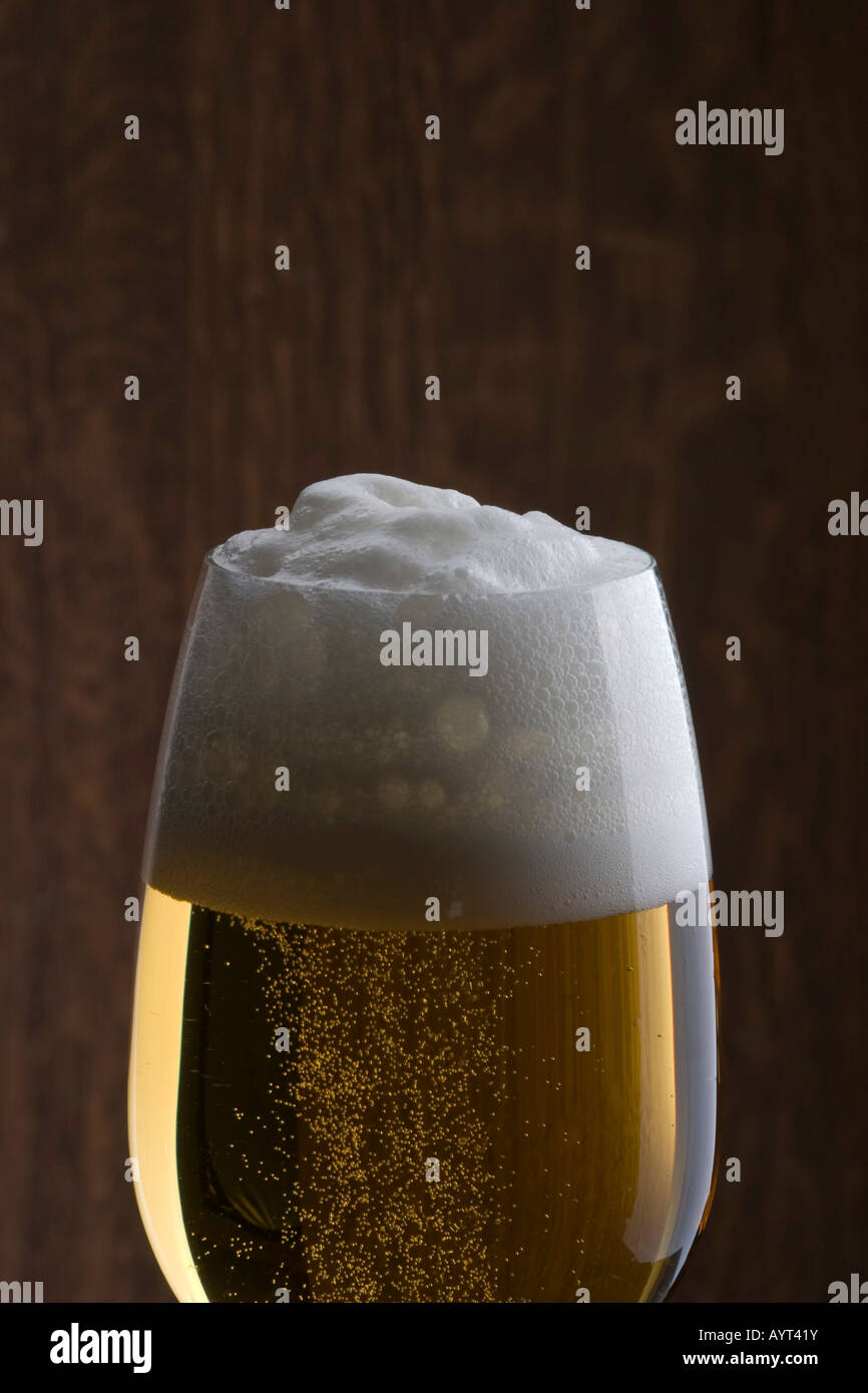 Glass of beer, foam top Stock Photo - Alamy