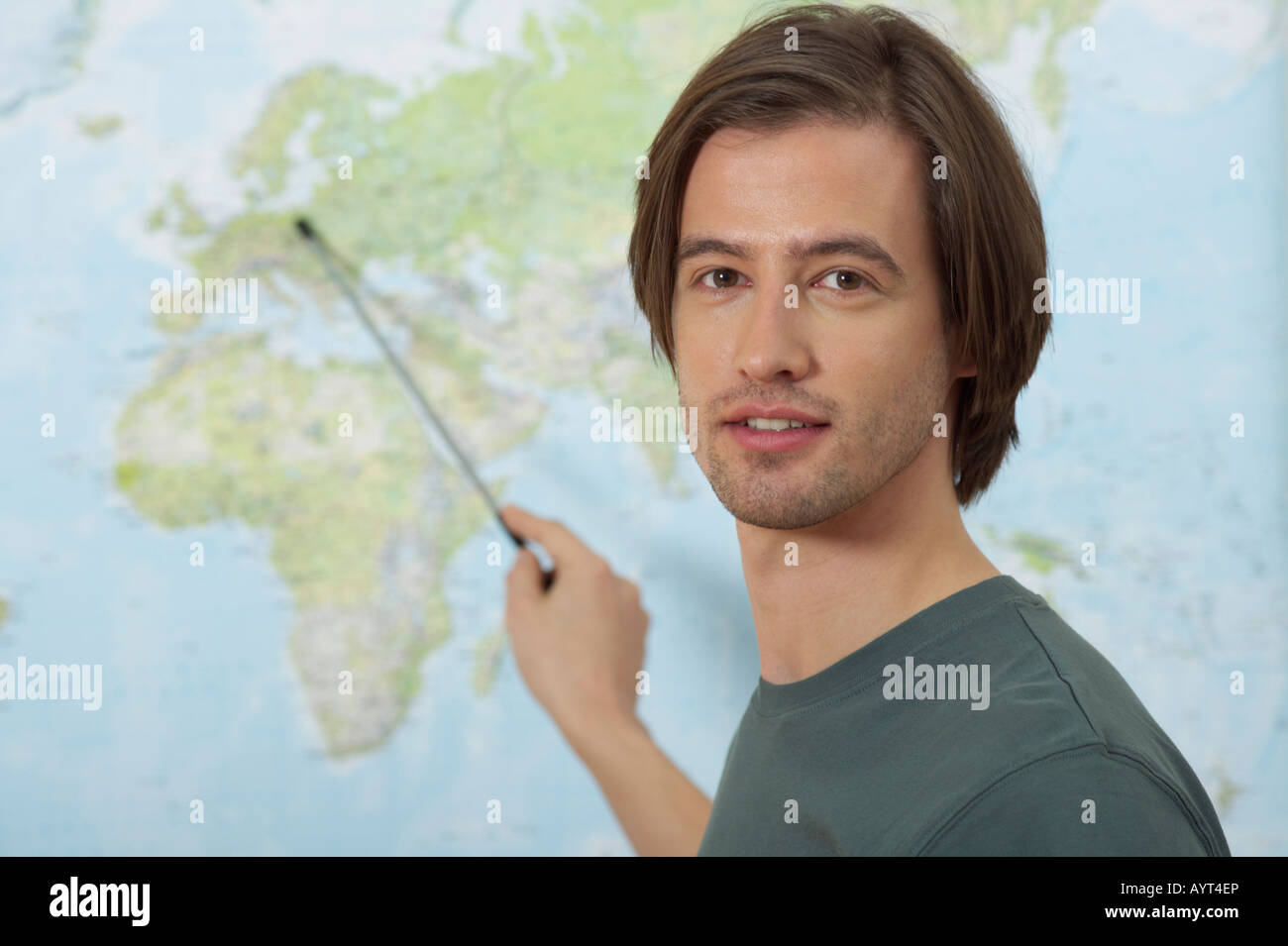 A man in front of a world map Stock Photo - Alamy