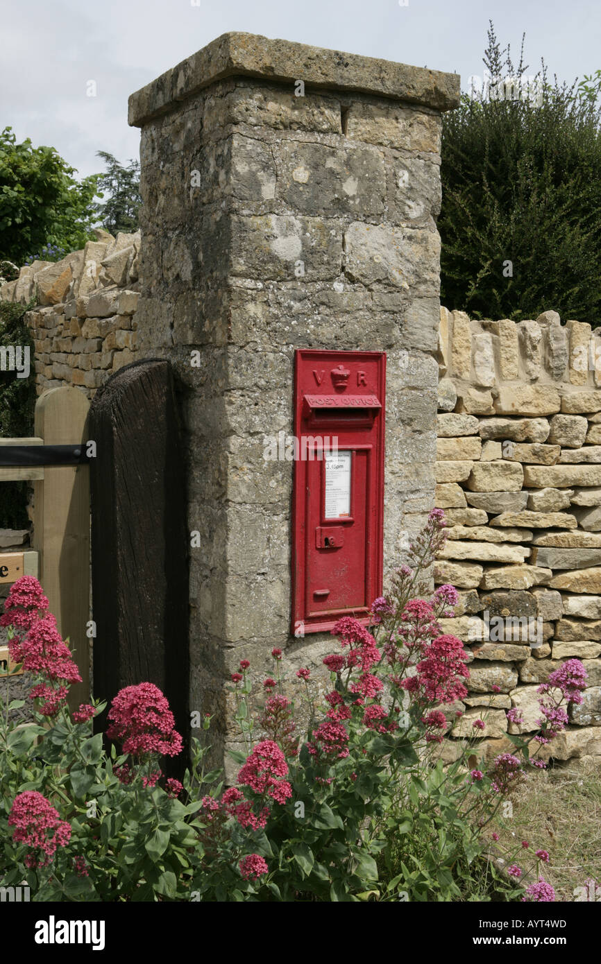 A post box and a cottage garden in the cotswolds at Chipping Campden ...
