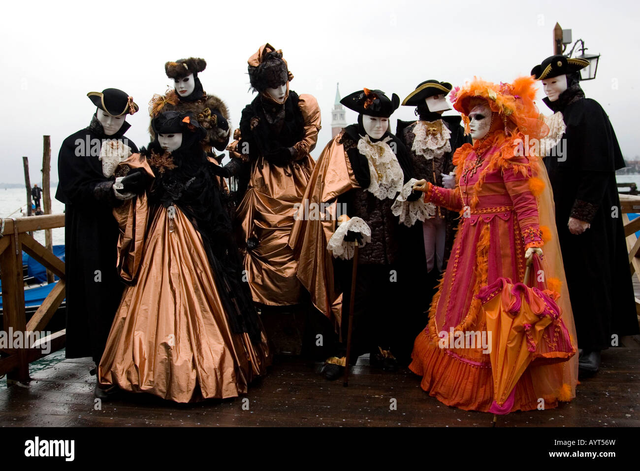 Black, brown and orange costumes and masks, Carnevale di Venezia ...