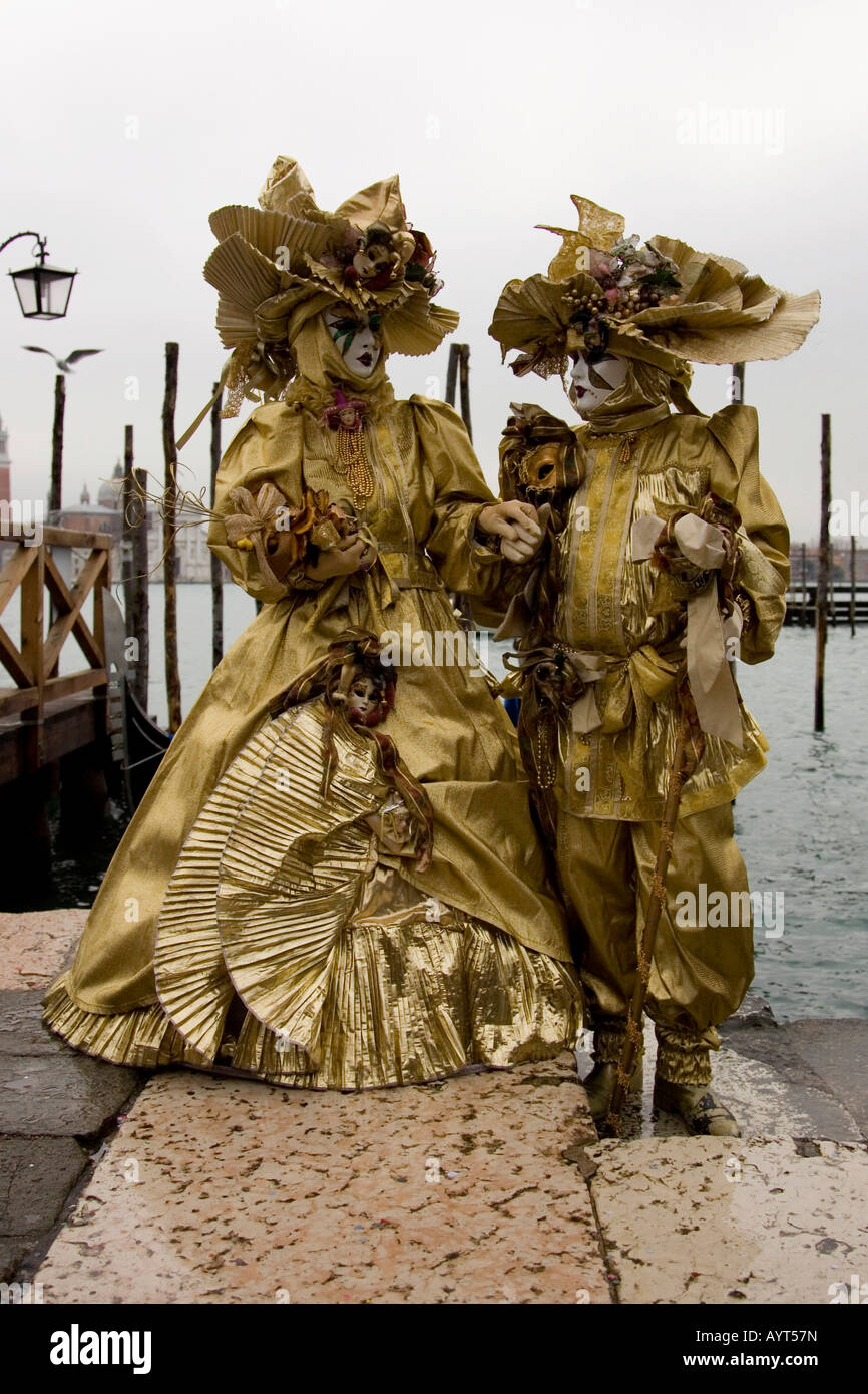 Two golden costumes and masks, Carnevale di Venezia, Carneval in Venice ...