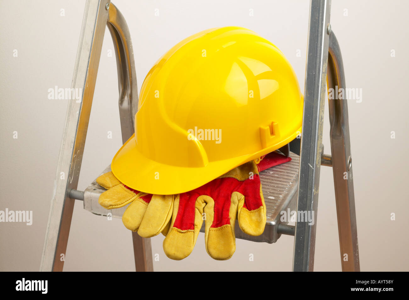 hard hat safety helmet rigger gloves step ladder Stock Photo - Alamy