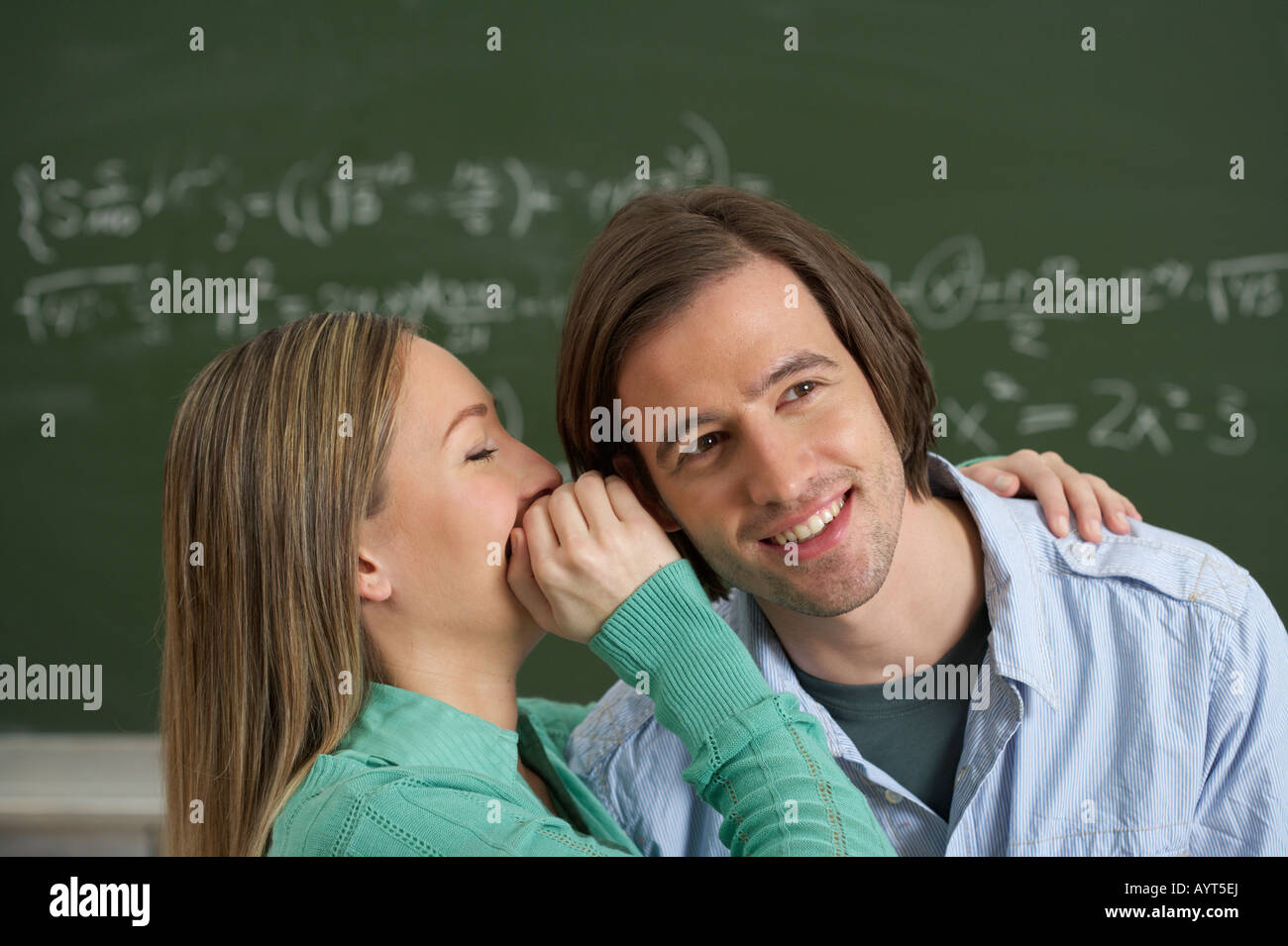 Woman whispering in mans ear hi-res stock photography and images - Alamy