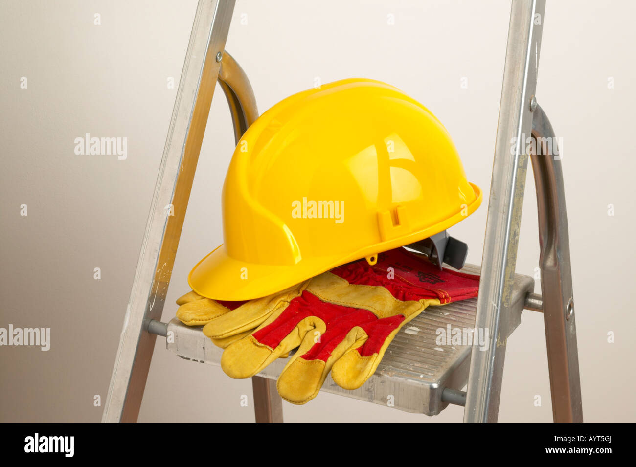 hard hat safety helmet rigger gloves step ladder Stock Photo - Alamy