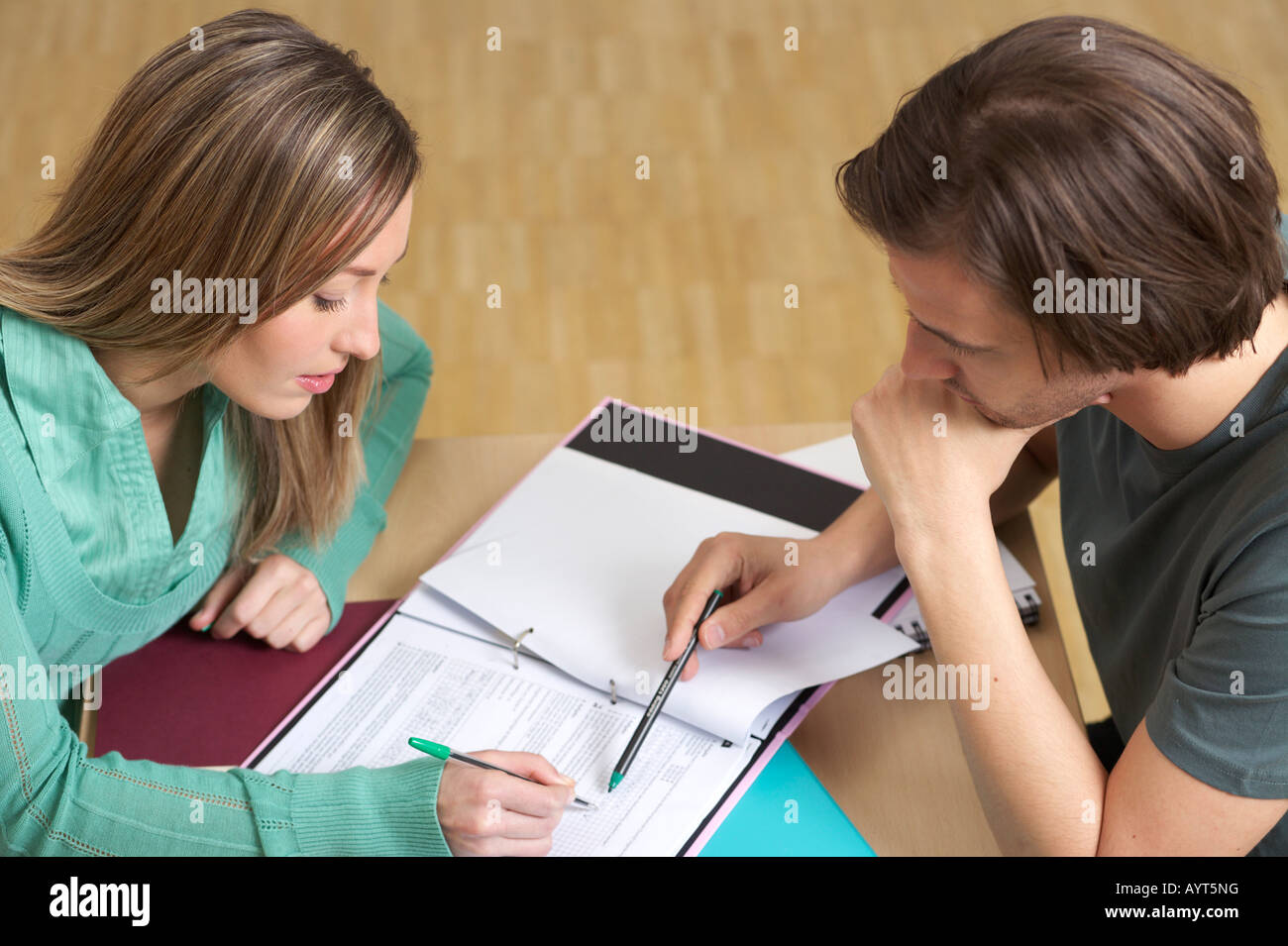 A couple learning Stock Photo - Alamy