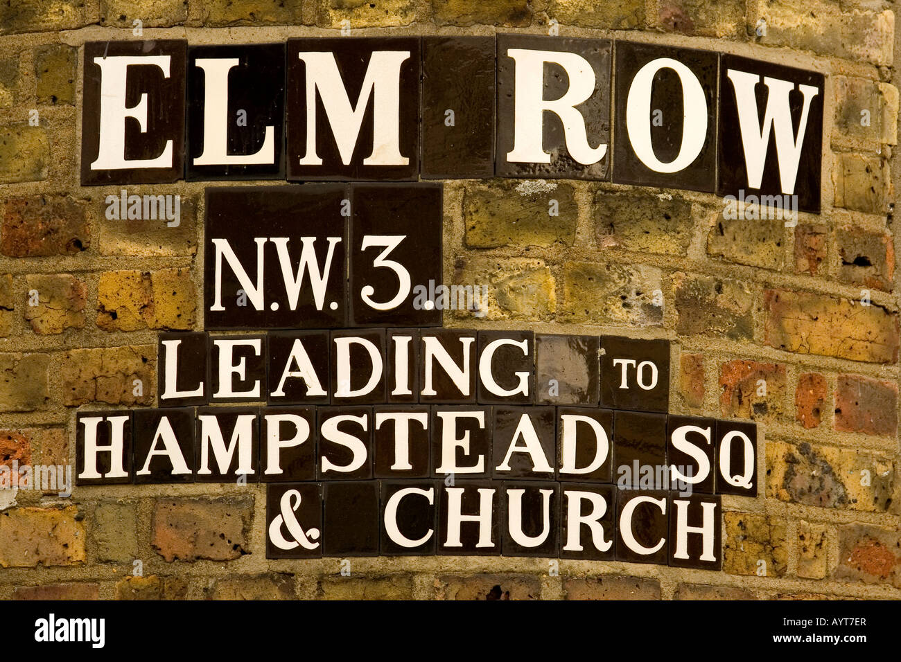 Old black and white tiled street name signs on brick wall Hampstead ...