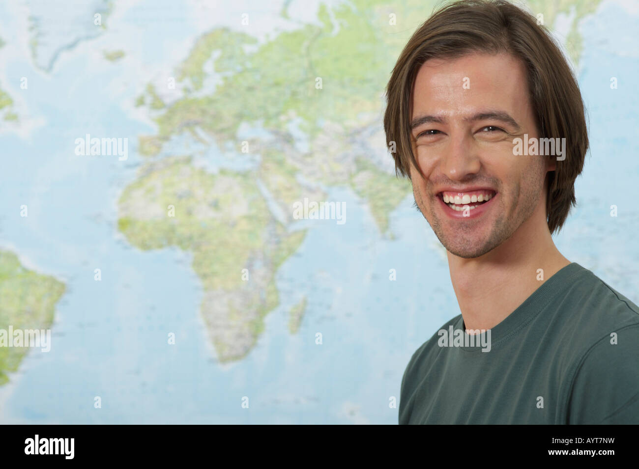 A Man in front of a world map Stock Photo - Alamy