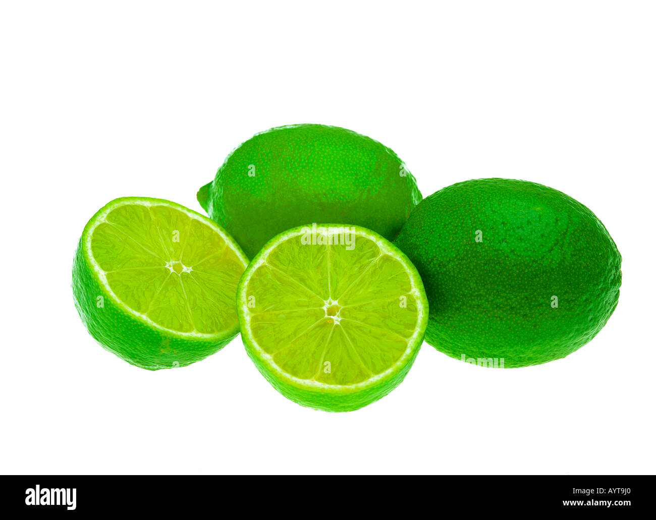 Cluster of four limes with one cut in half Stock Photo - Alamy