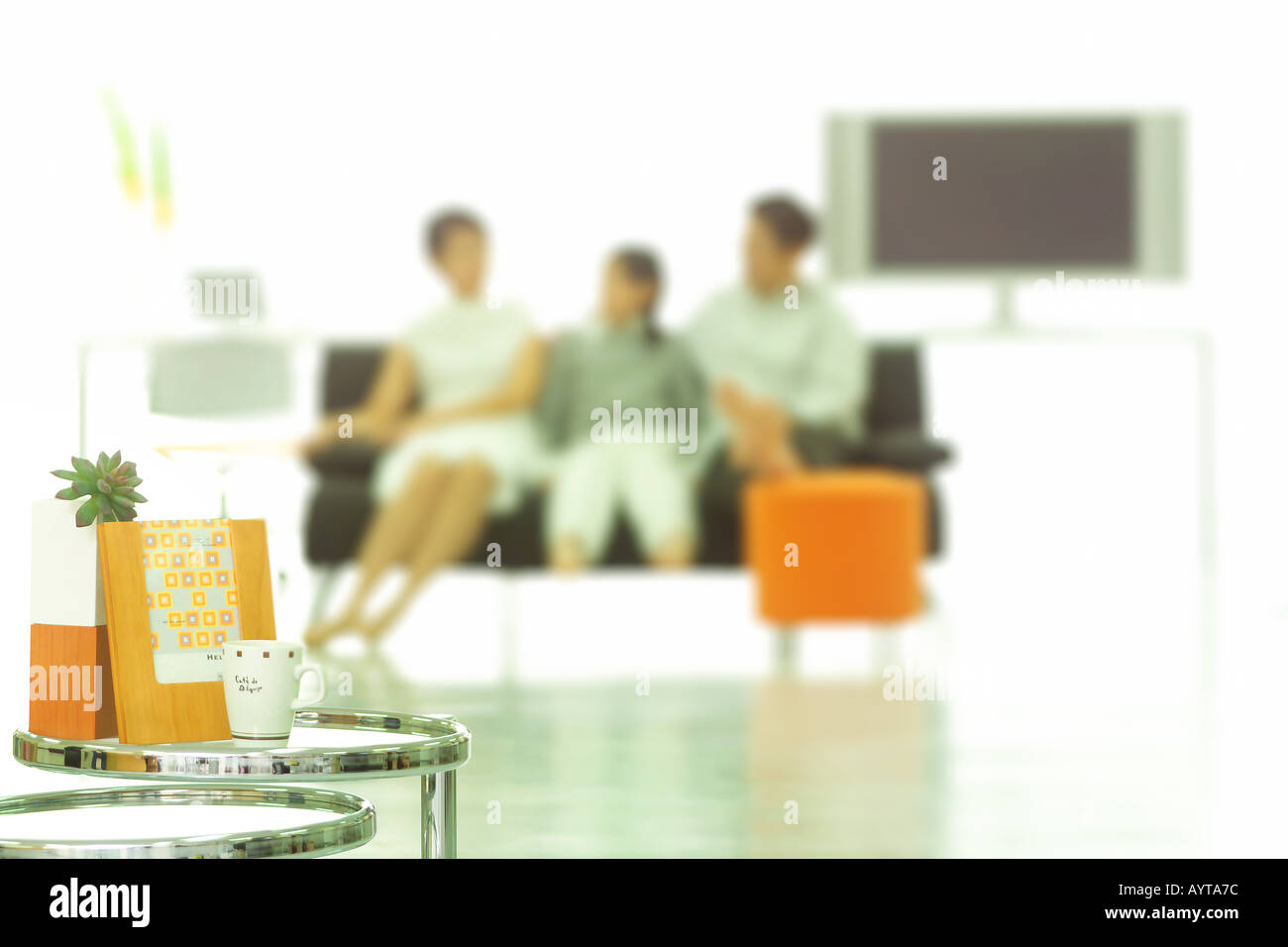 Family in a modern living room Stock Photo - Alamy