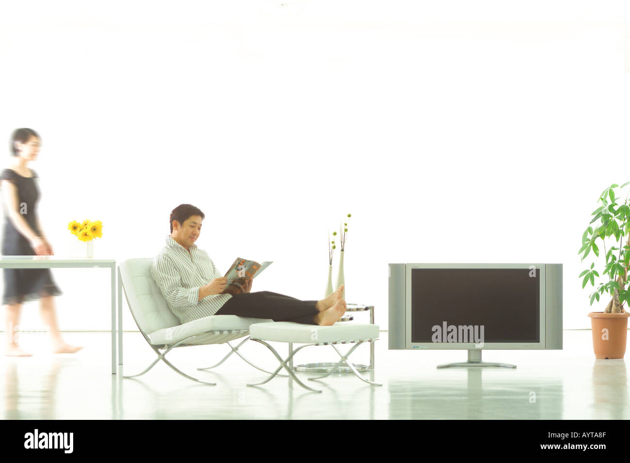 Couple in a modern living room Stock Photo - Alamy