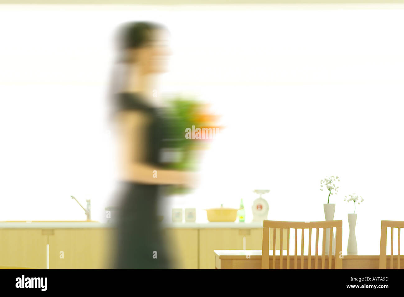 Woman walking dining room hi-res stock photography and images - Alamy